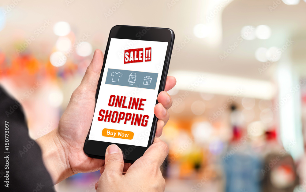 Close up hand holding mobile phone with online shopping app on screen ...
