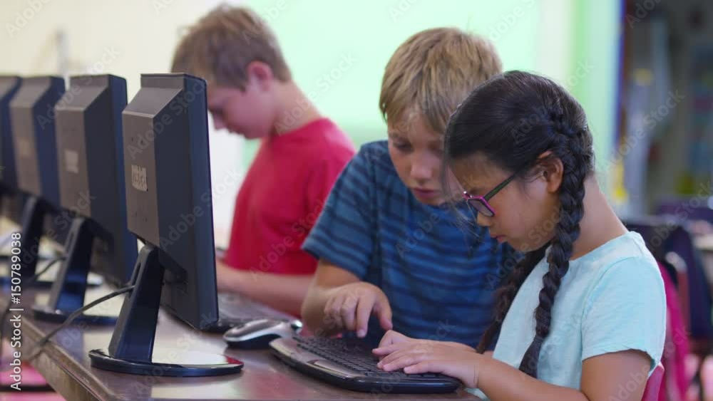 Students in school classroom using computers Stock Video | Adobe Stock