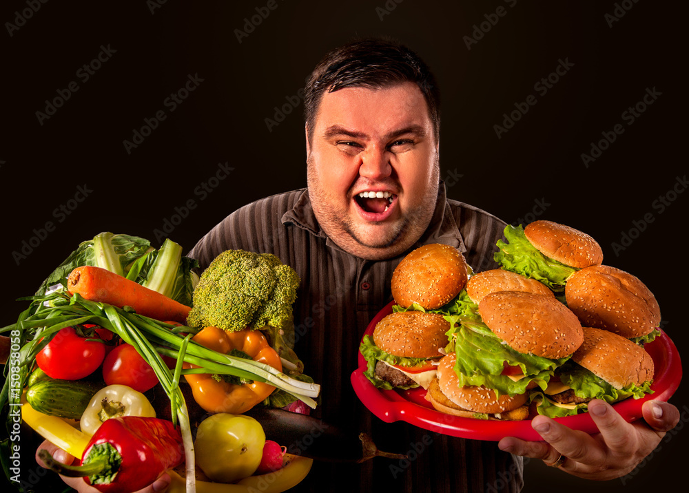 Stockfoto Diet fat man who makes choice between healthy and unhealthy ...