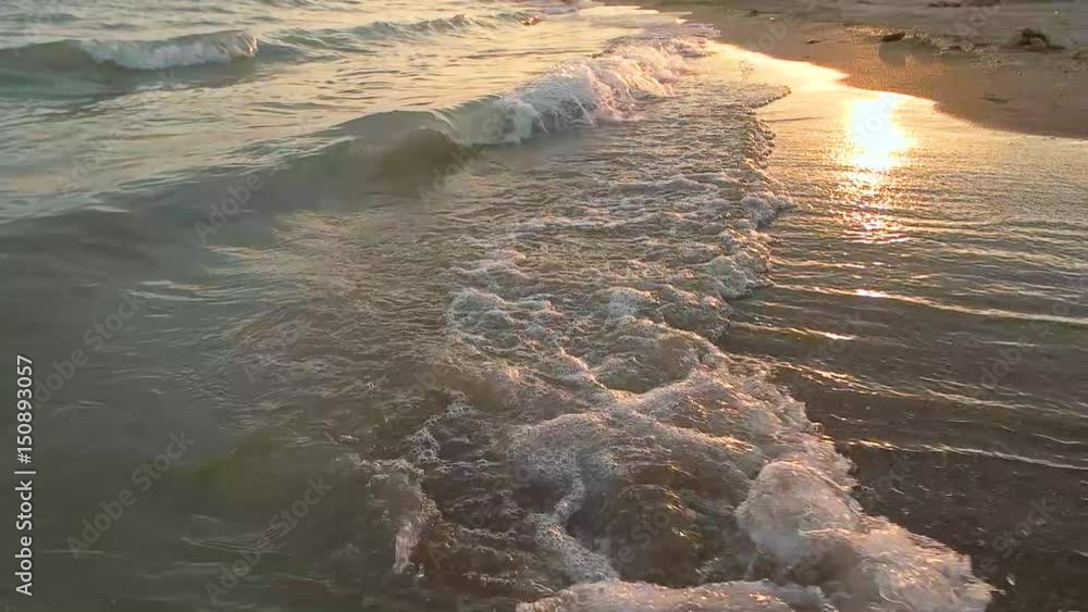 Waves on seashore, slow-mo. Sea during sunset. Stock Video | Adobe Stock