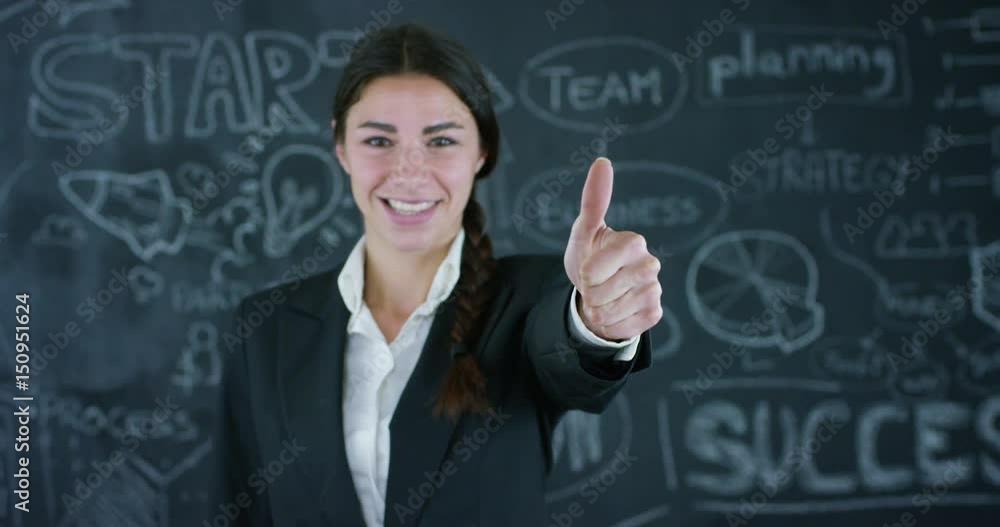 Beautiful business girl, marketing teacher, draws a graph of success on ...