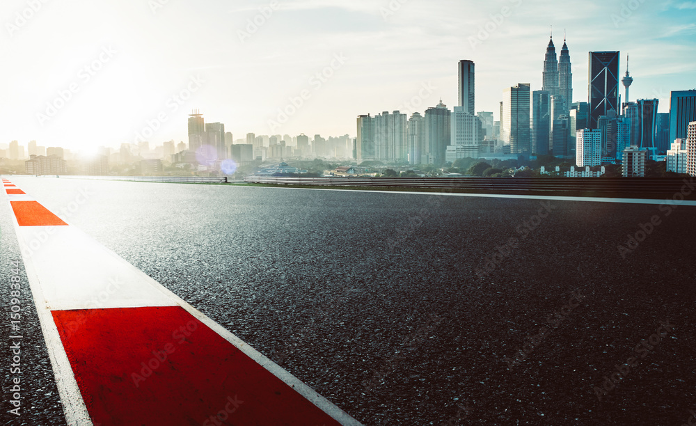 Racetrack with red and white safety sideline ,modern city background ...
