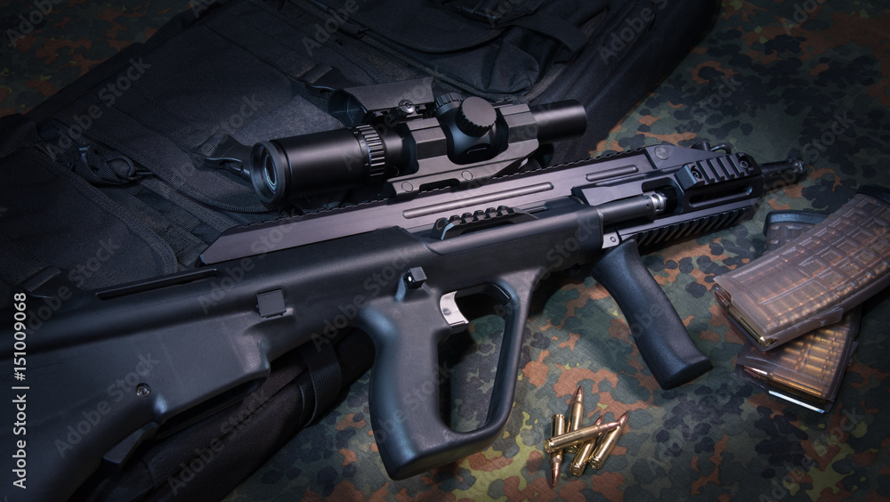 Photo & Art Print Black semiautomatic rifle with a scope on a vintage ...