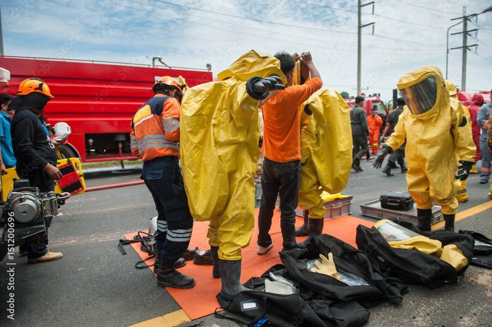 firefighter with hazmat (hazardous material) suits to protect them from ...