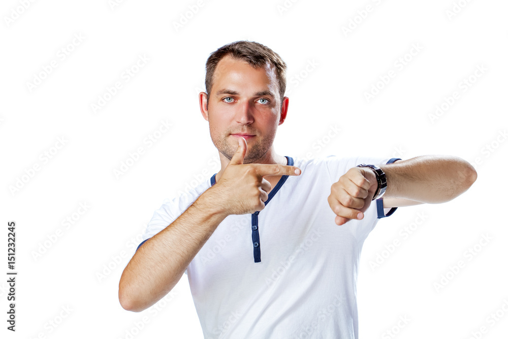 Young man running out of time looking his watch isolated on a white ...