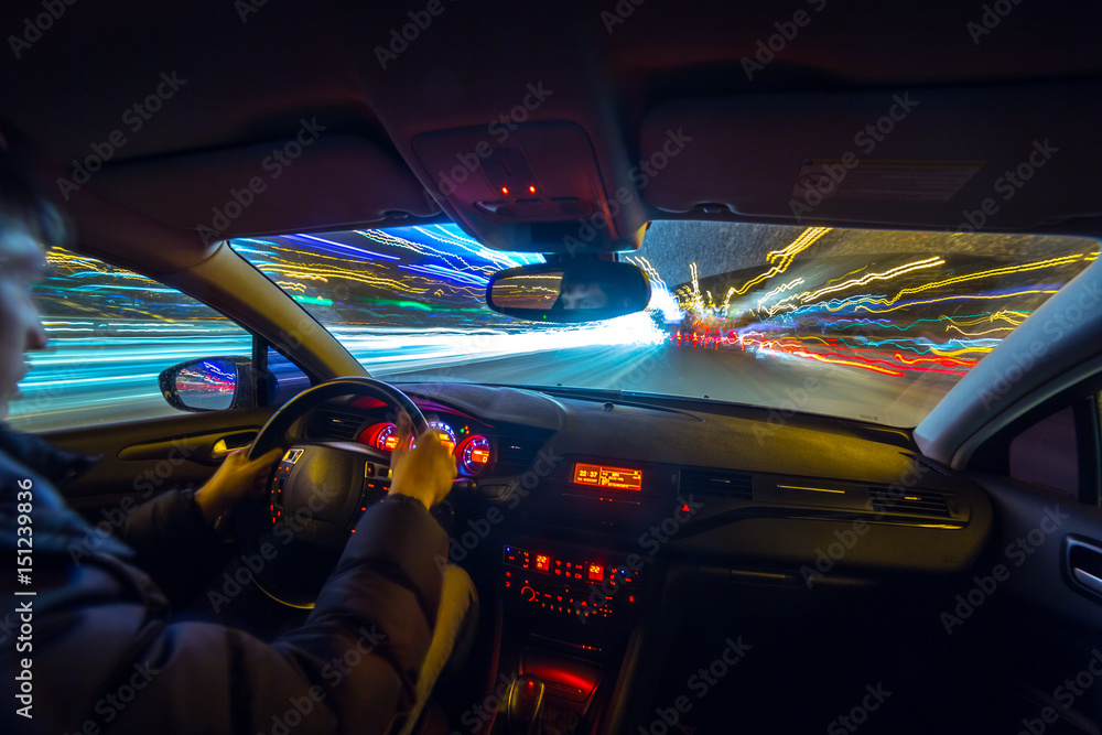 City road view from inside car natural light street and other cars is ...