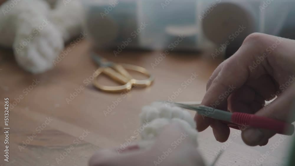 Stockvideon Wdoing a teddy bear. The concept of exclusive work. Craft ...