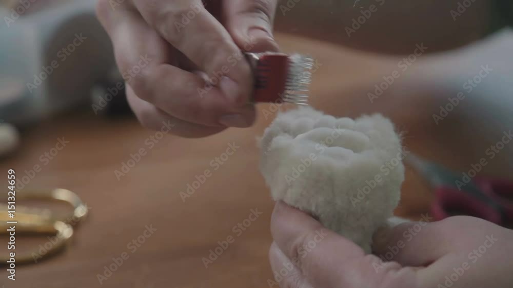 Stockvideon Teddy bear: the process of creation. Female hands sew parts ...