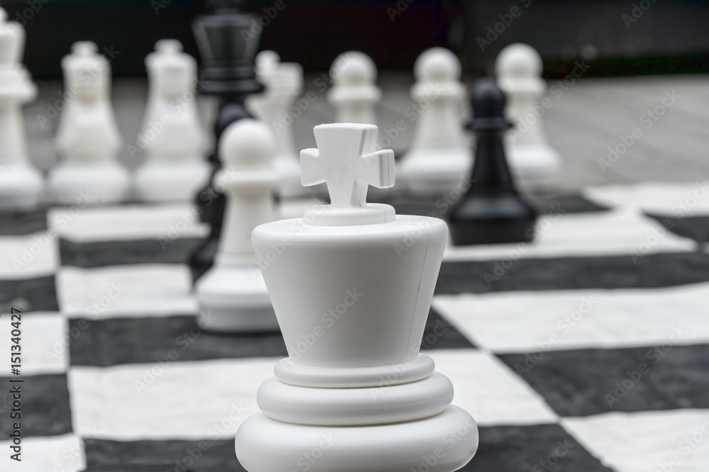 Life size chess pieces and giant chess board Stock Photo | Adobe Stock