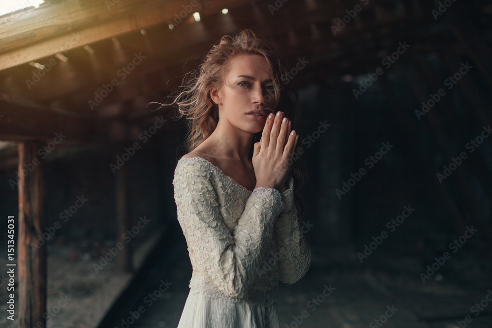 Beautiful girl in in white vintage dress with curly hair posing on the ...