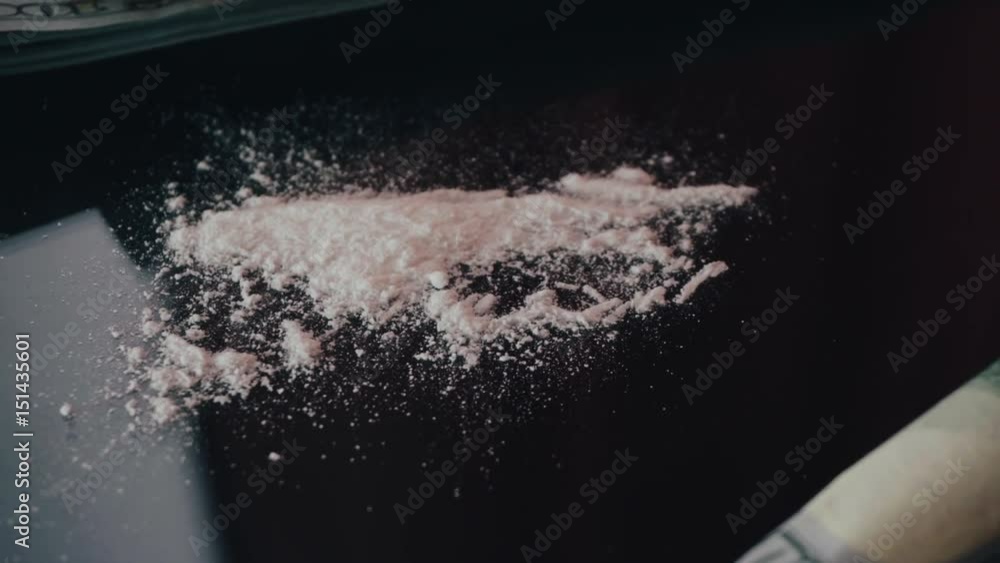 cocaine with dollar bills close-up. Drugs for rich people. Snork line ...