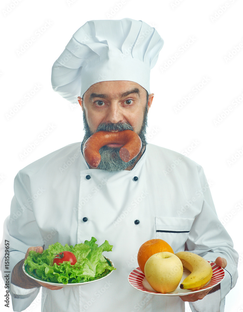 chief cook holding Fried chicken and vegetables. Stock Photo | Adobe Stock