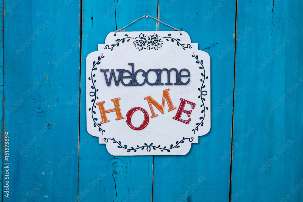 Welcome HOME sign with floral border hanging on rustic antique teal ...