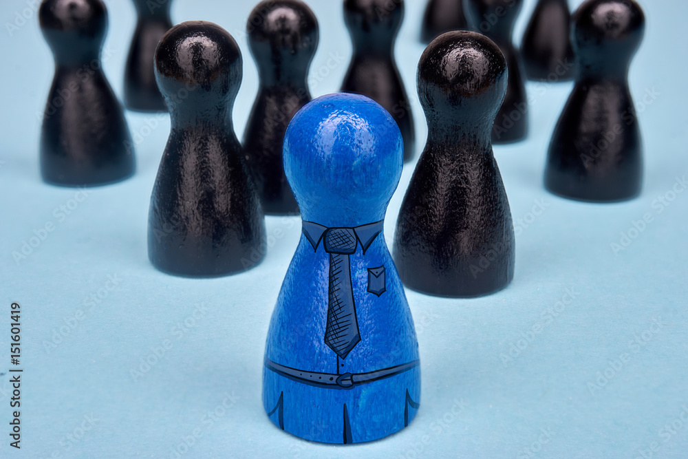 Teamleader with his team. Symbol for leadership with game figures in ...