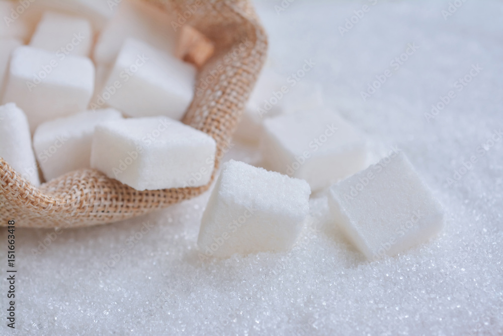 White cube sugar on granulated sugar. These are the nutritive ...
