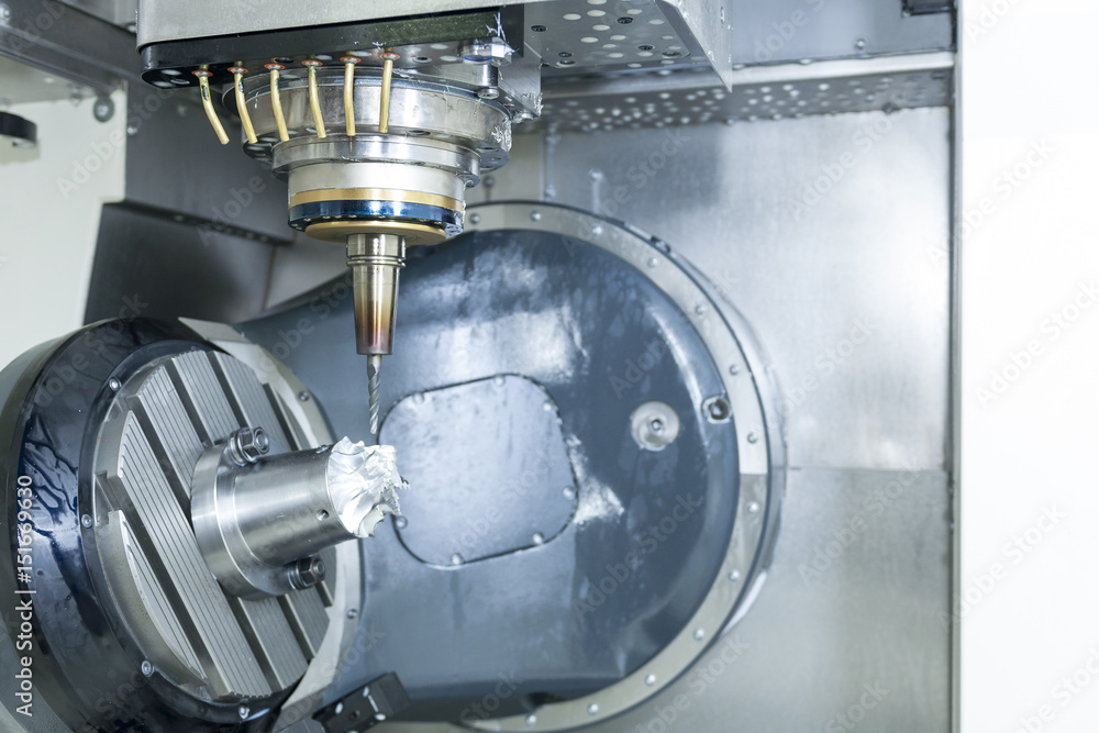 The 5 axis CNC machine while cutting sample aerospace part. Turbine ...