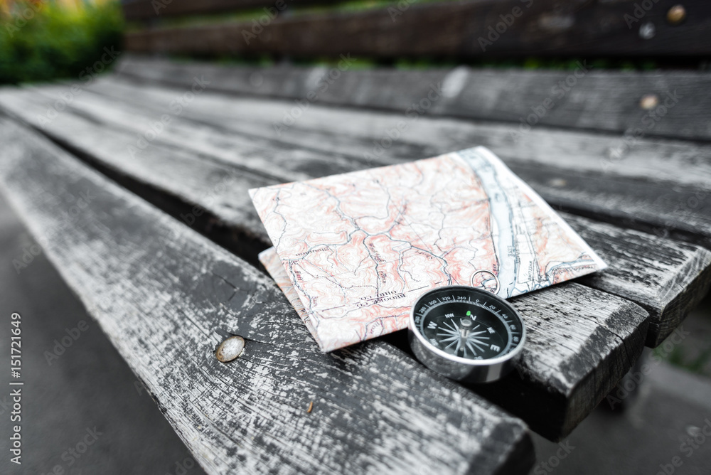 Compass and map on a beautiful wooden surface Stock Photo | Adobe Stock