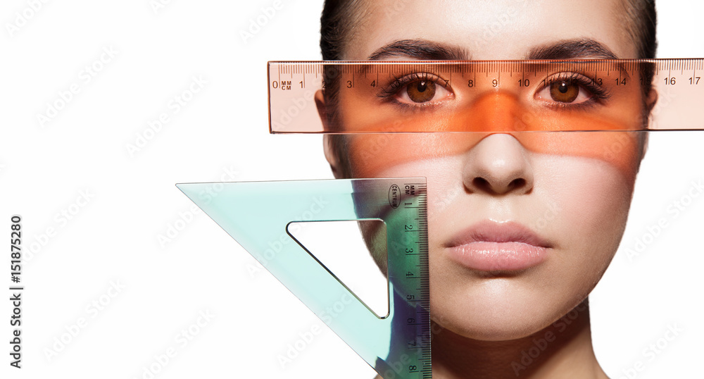 Measure the proportions of a beautiful female face with rulers before ...