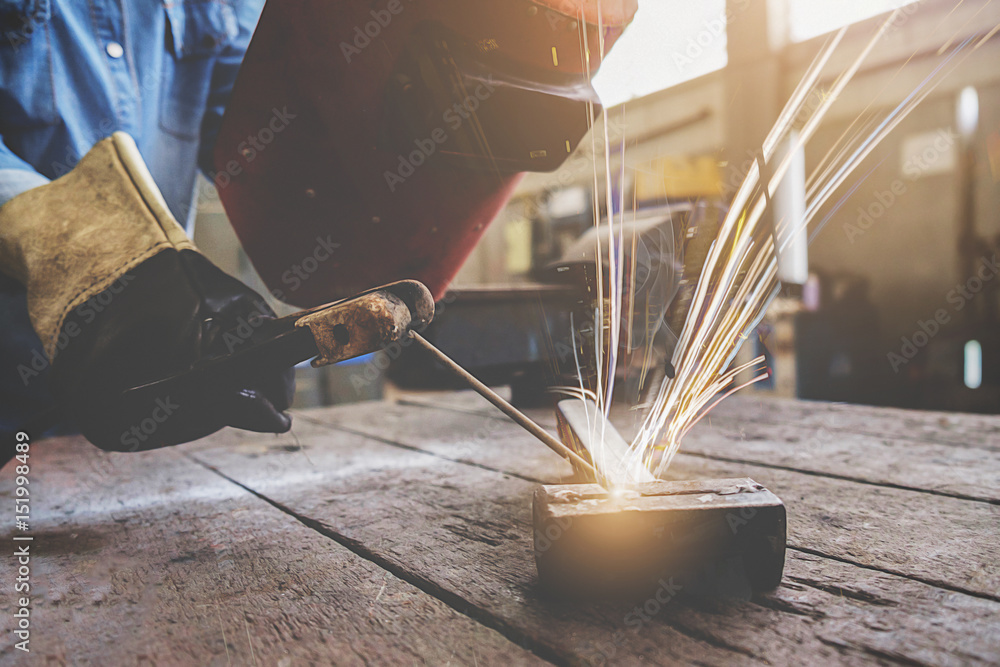 Inverted welding machine,welding equipment on a wooden desk with ...