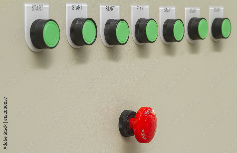 Red emergency stop switch and reset with green start buttons. Control ...