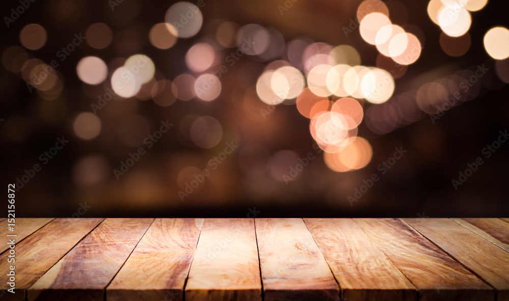 Wood table top with blur light bokeh in dark night cafe,restaurant ...