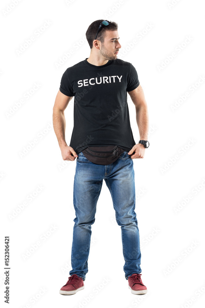 Cautious undercover police officer adjusting shirt looking away alerted ...