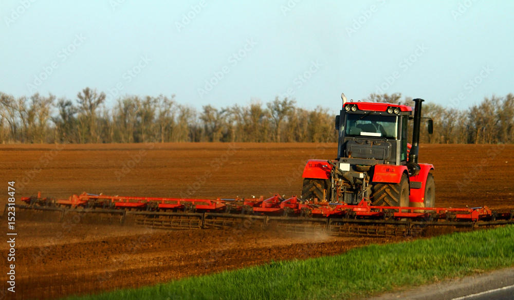 Soil preparation with a tractor Stock Photo | Adobe Stock