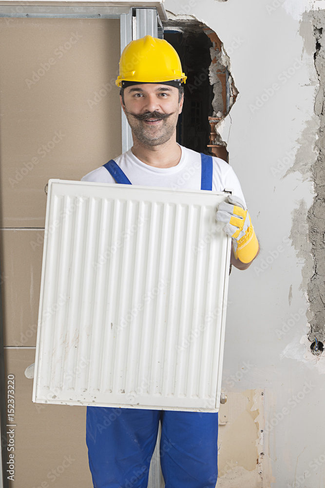Plumber with Mustache Carrying Radiator Stock-Foto | Adobe Stock