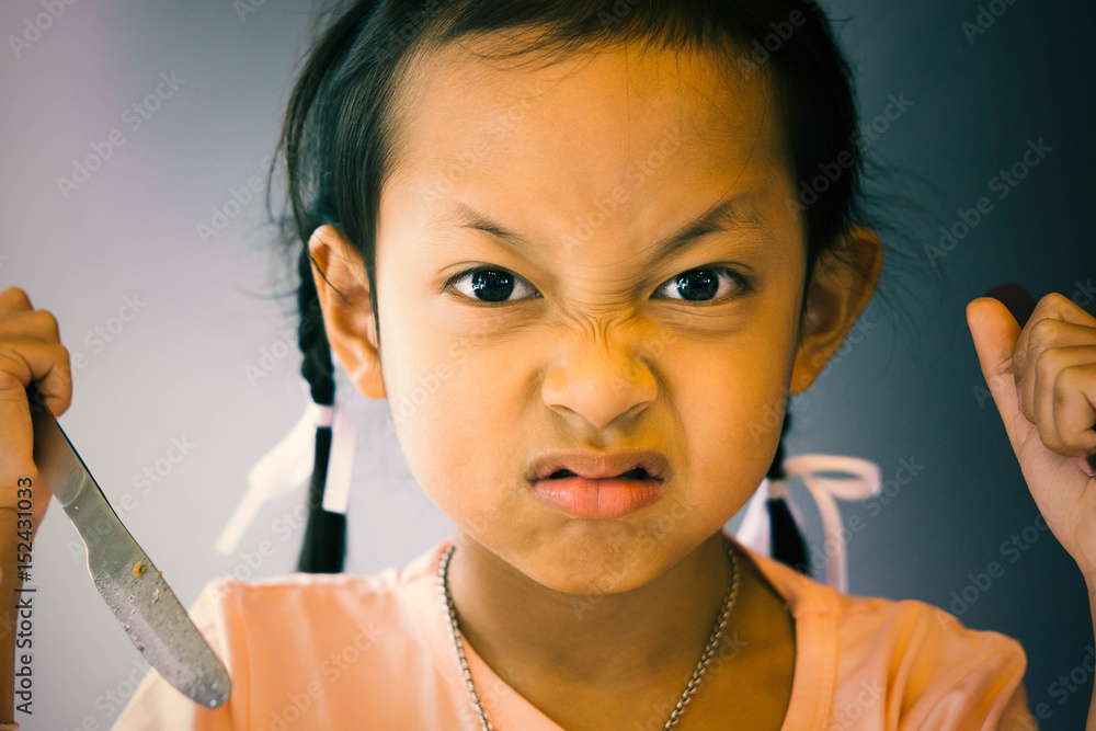 Angry asia child girl. Concept of violent in childs. Stock Photo ...
