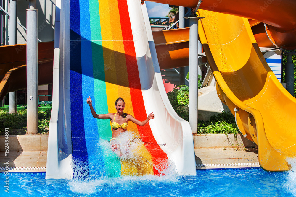 Swimming pool slides for children on blue water slide at aquapark ...