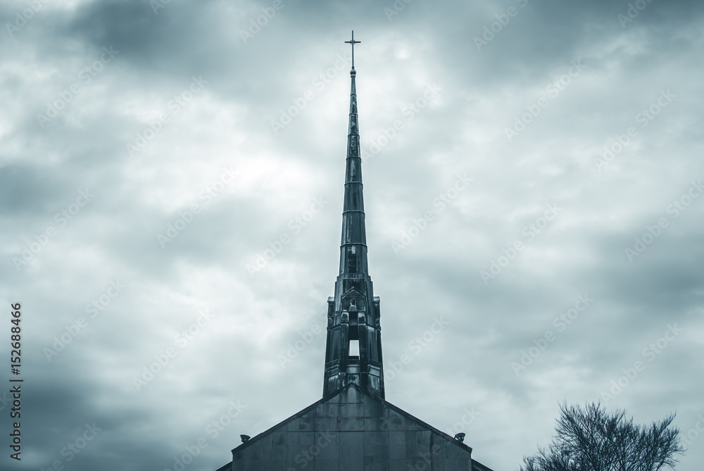Church steel brass spire. Church building roof with spire and holy ...