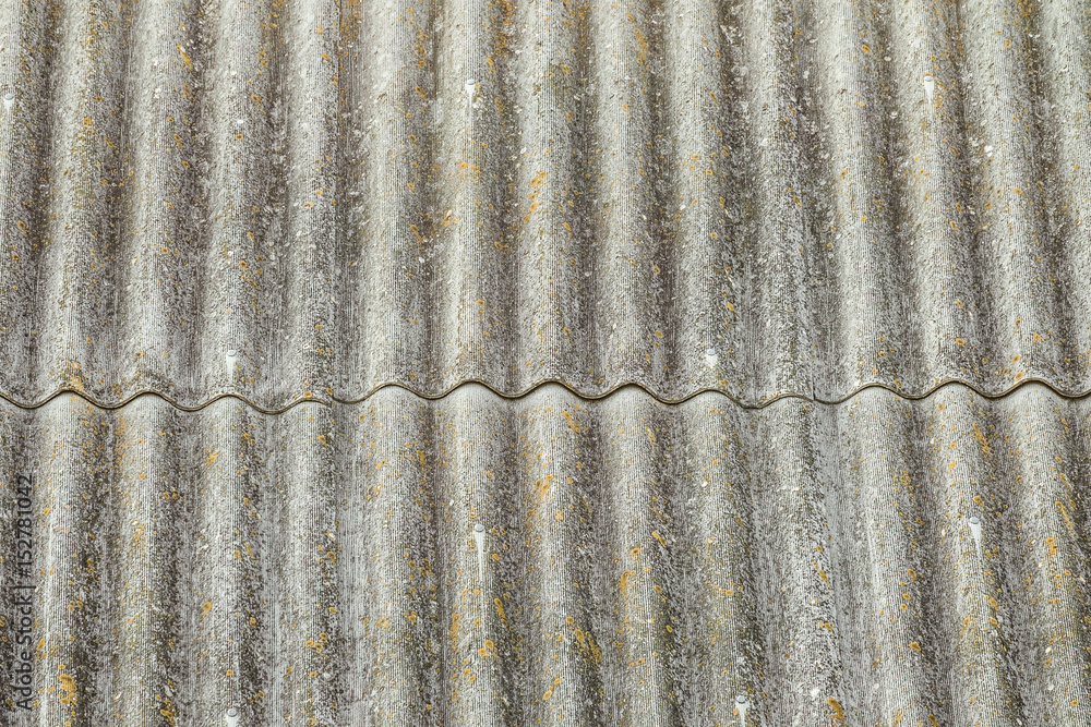 Asbestos cement sheets. Texture of old laid roofing sheets. Grey roof ...