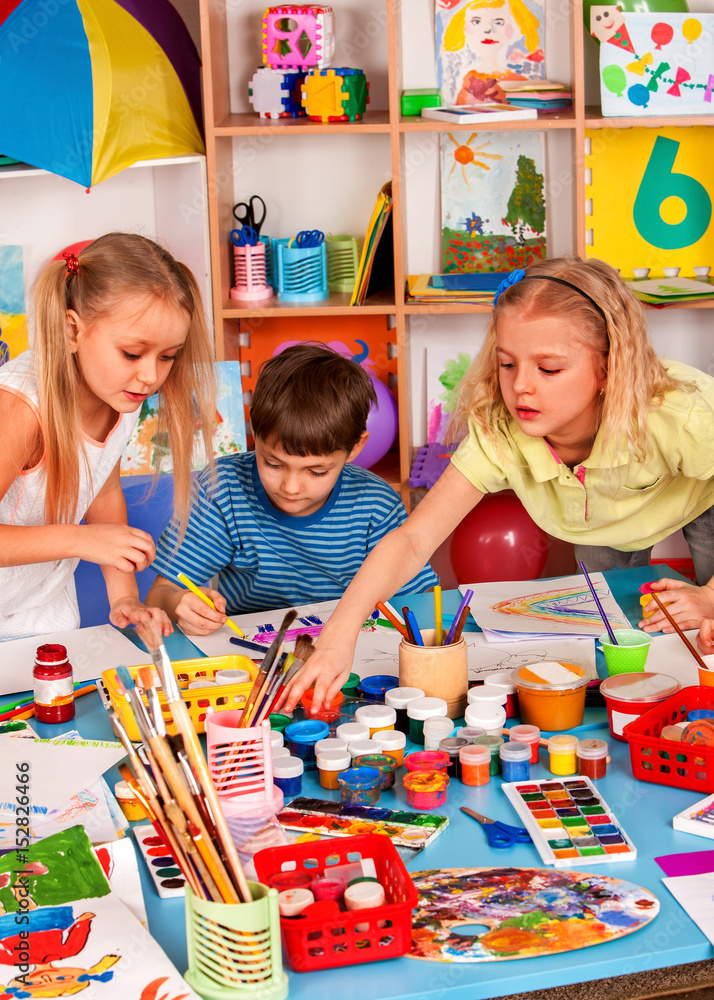 Small students painting in art school class. Children boy and girl ...