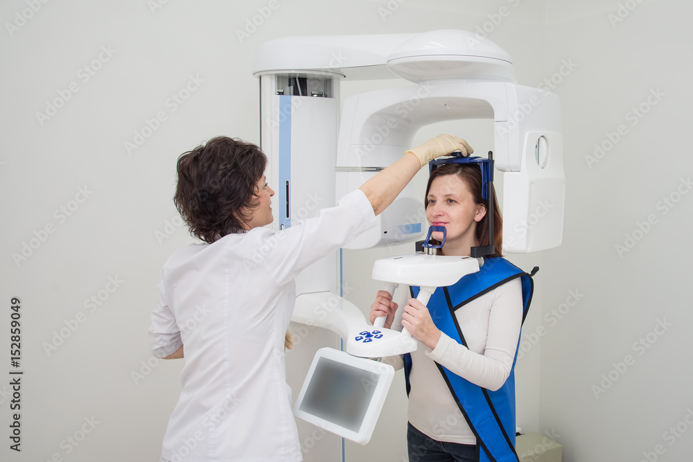Dentist taking a panoramic digital X-ray of a patients teeth Stock ...
