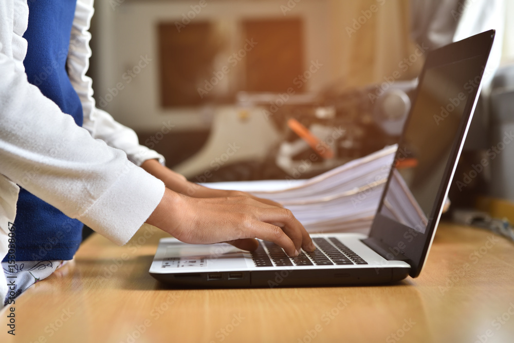 Employ key data into a laptop. Stock Photo | Adobe Stock