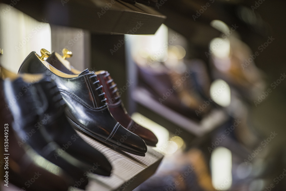 Men shoes in a luxury store in Paris. Stock Photo | Adobe Stock