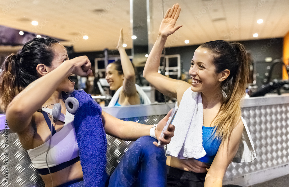 Two women having fun after work out in gym Stock-Foto | Adobe Stock