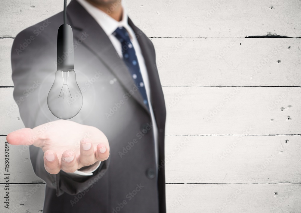 Business man hand out with glowing lightbulb Stock Photo | Adobe Stock