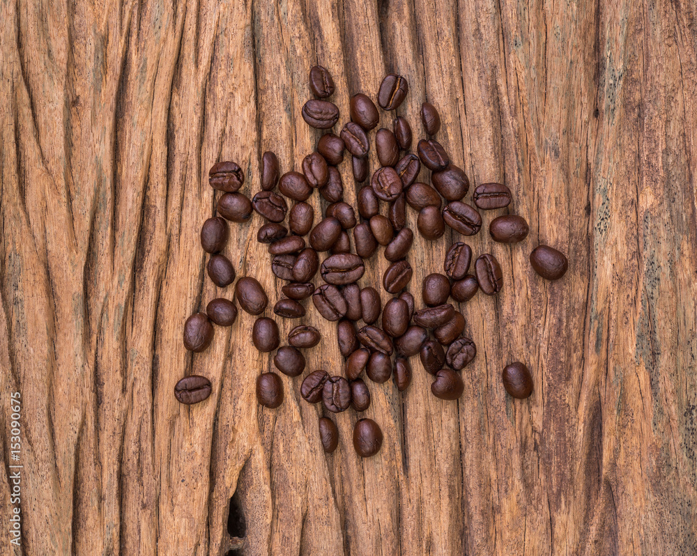 Roasted coffee beans on wood texture background Stock Photo | Adobe Stock