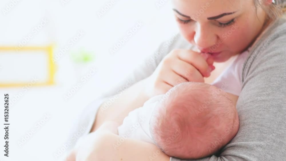 Breastfeeding concept. Young happy mother feeding her newborn baby. 4K UHD video 3840X2160 Stock ...
