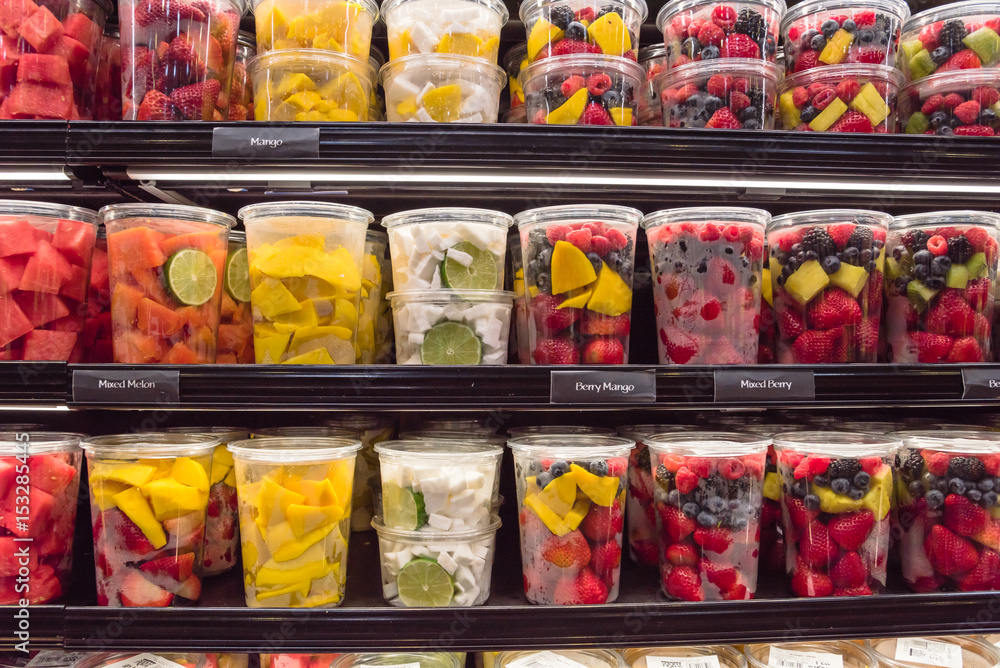Fresh chopped and chunks fruit plastic box display in store at Houston ...
