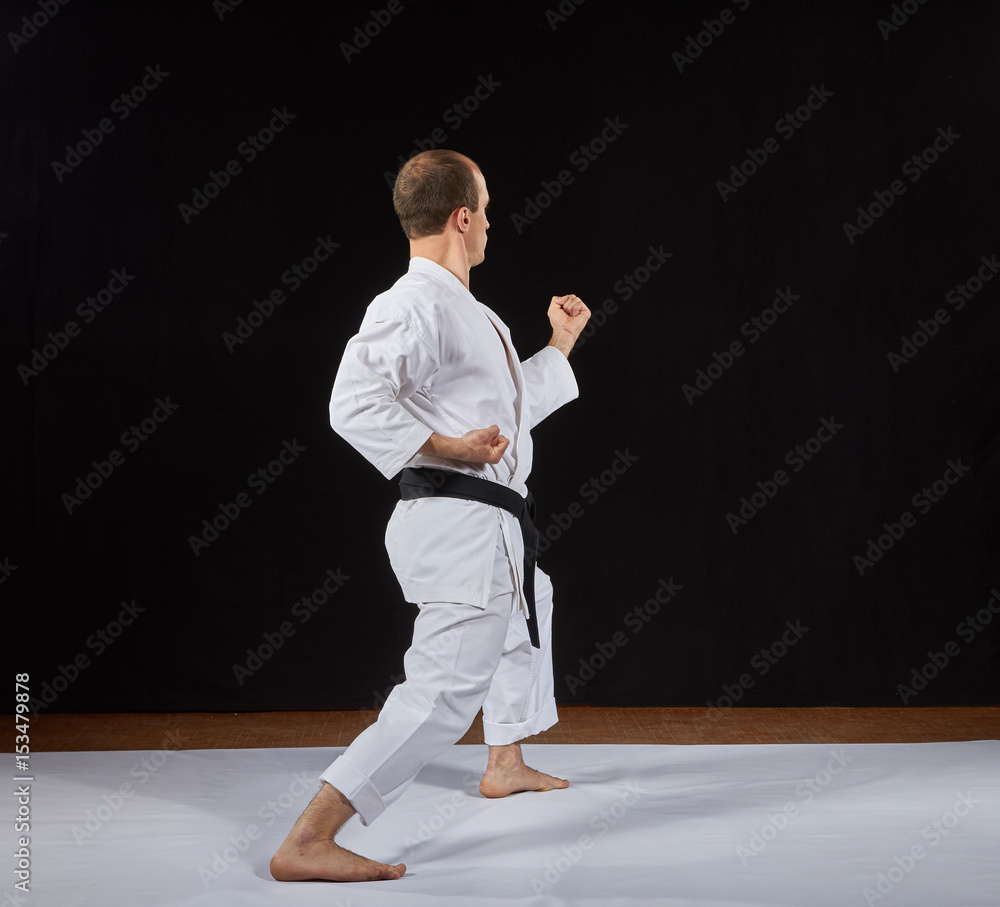 In a karate stand, a sportsman makes a block with his hand Kaderov ...