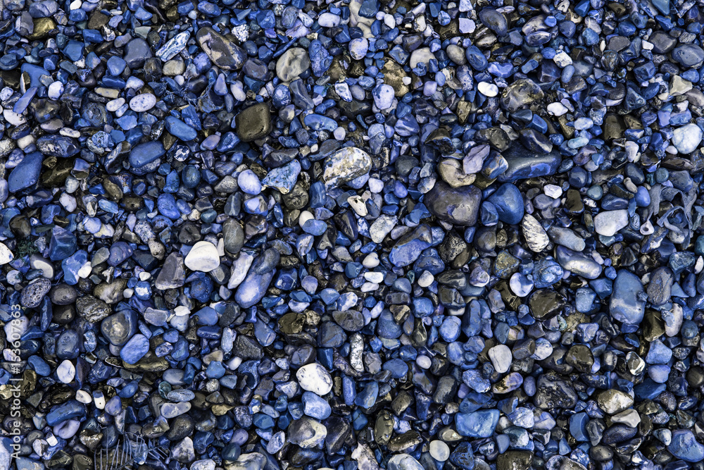 Unnatural world. Blue beach pebbles. Stones and gravel used as ...