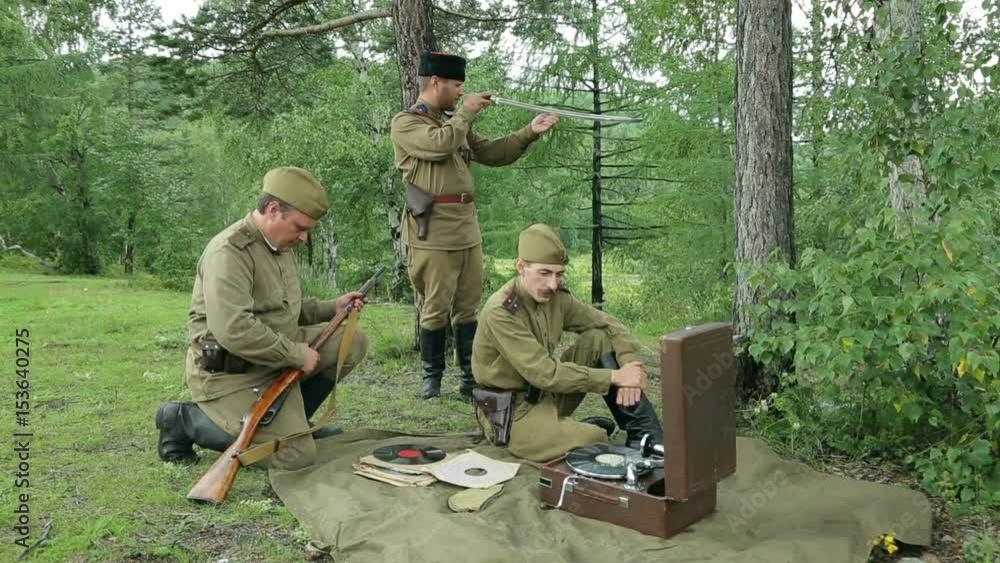 The army of the USSR. Soviet army soldiers are resting. Soldiers listen ...