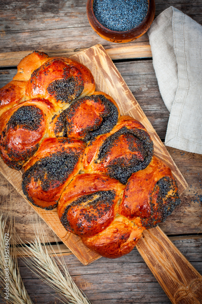 Hala, traditional Jewish bread with poppy seeds, selective focus, top ...