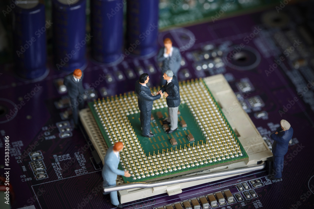 Selective focus of miniature businessman handshake about partnership on ...