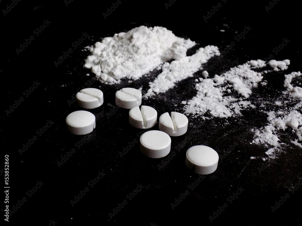 Cocaine drug powder pile and lines and pills on black background Stock ...