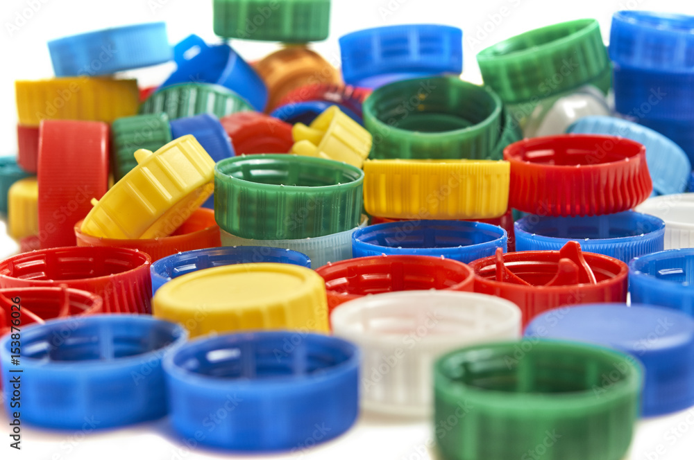 Recycled plastic bottle caps isolated on white Stock Photo | Adobe Stock