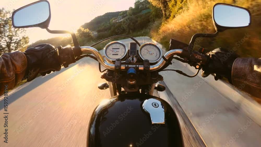 POV of masculine and manly motorcycle driver driving his vehicle ...