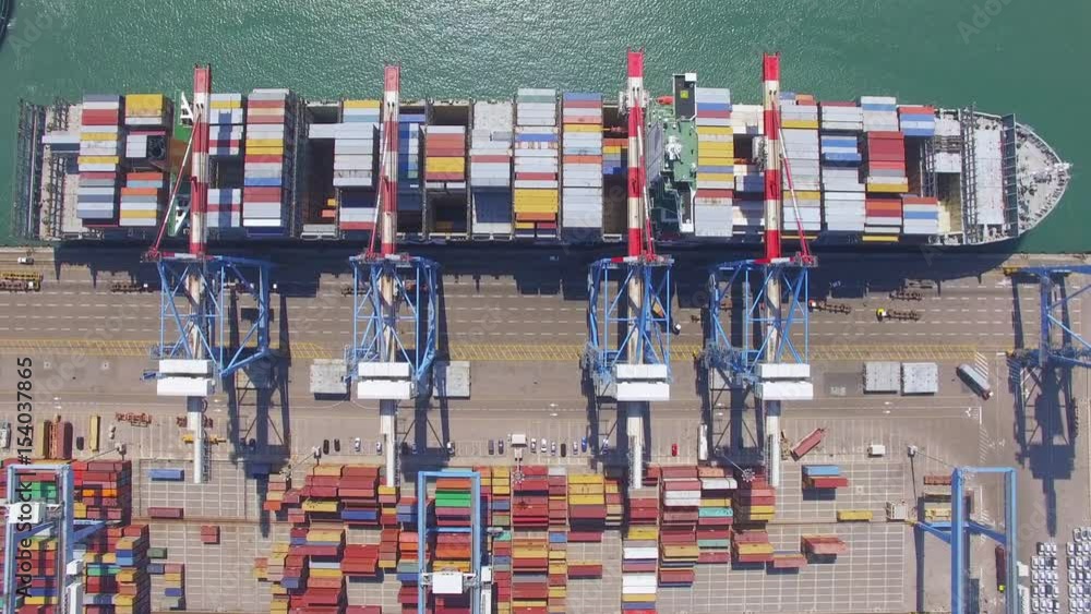 Aerial Time lapse - Commercial port with container ship during loading ...